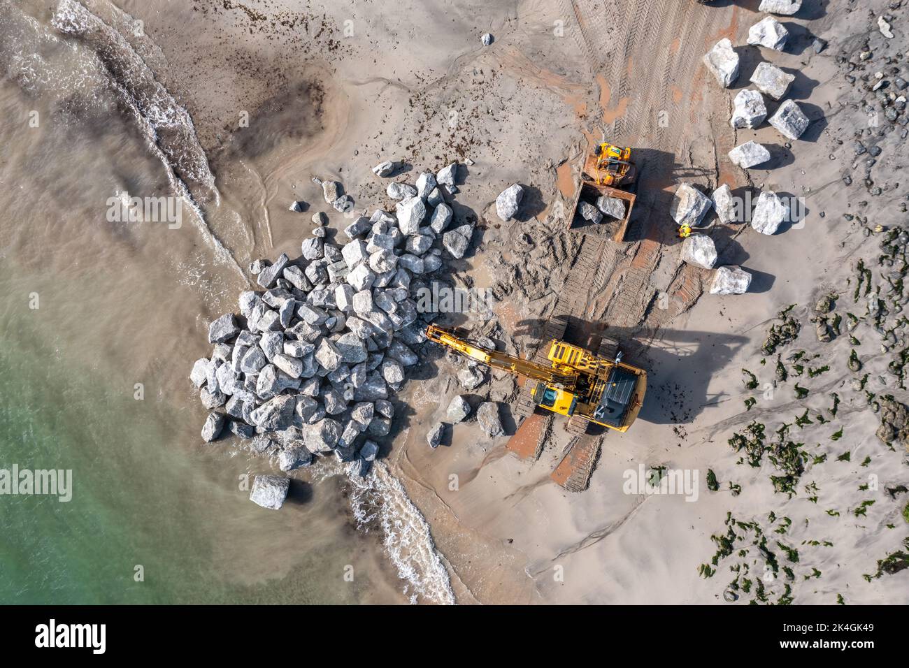 aerial view directly above Mechanical diggers on a construction site ...