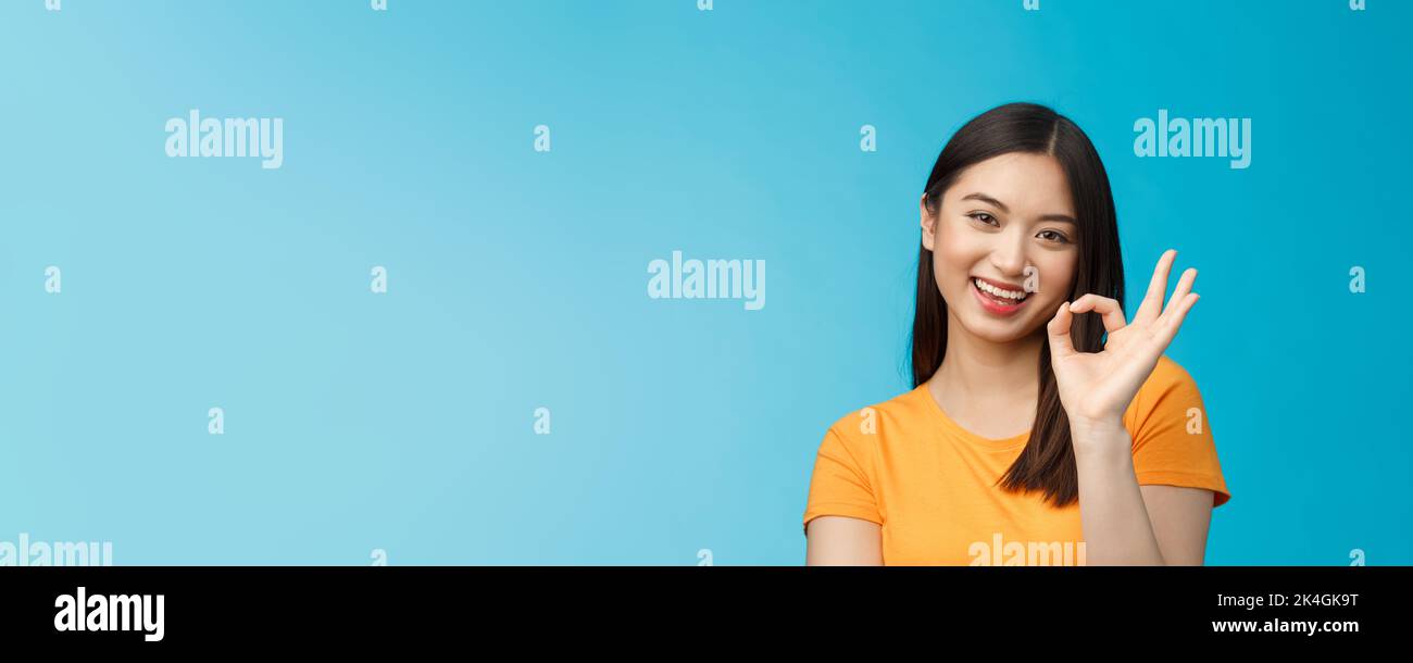 Close-up cute asian friendly girl supports your fantastic idea, smiling ...