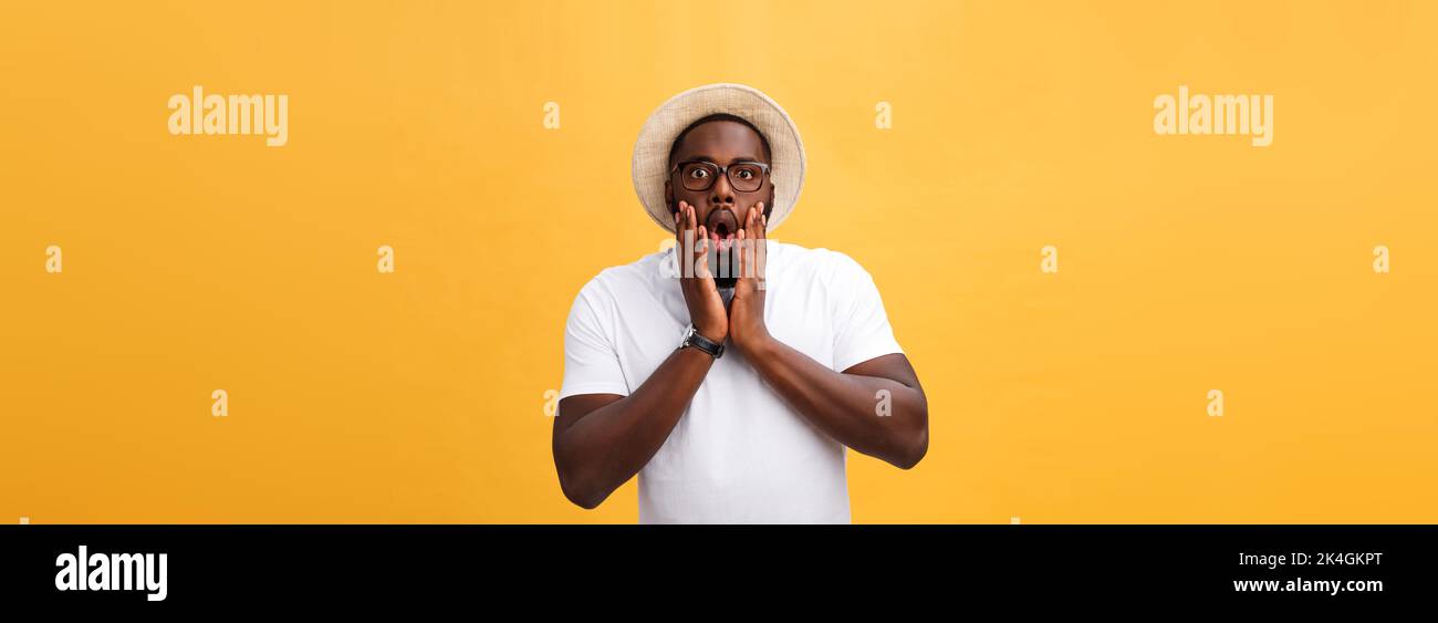 Headshot of goofy surprised bug-eyed young dark-skinned man student ...