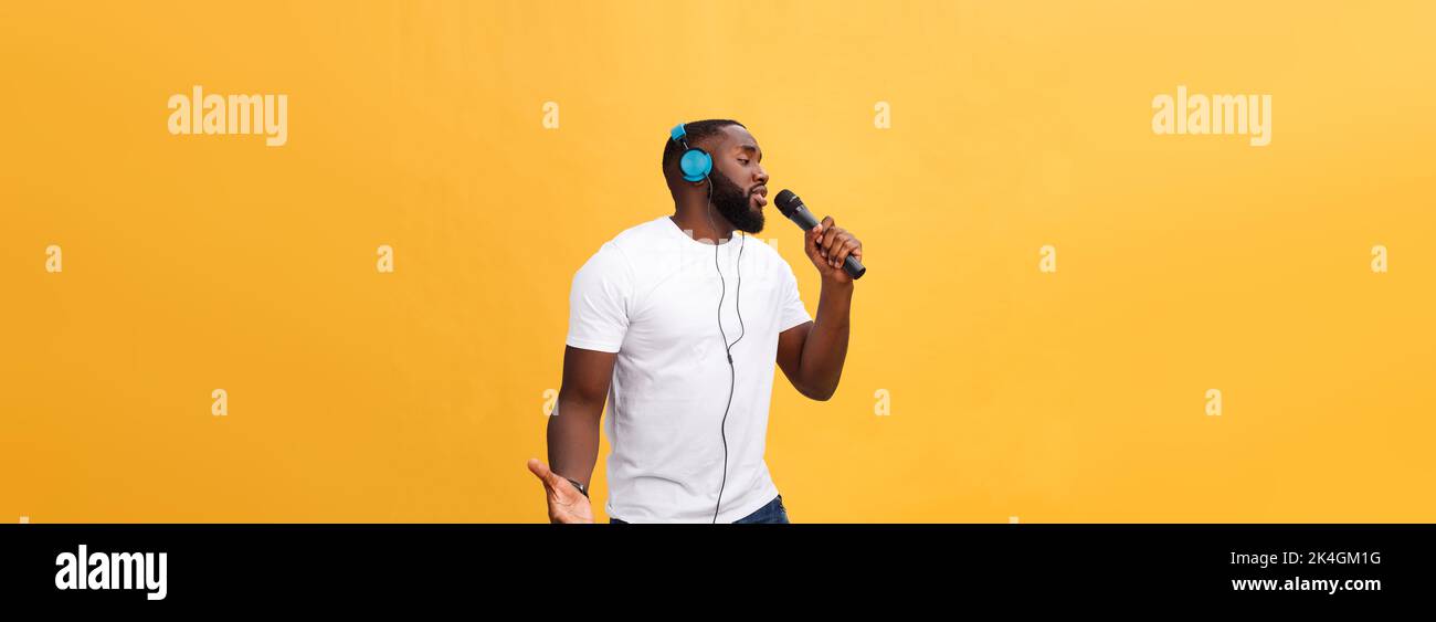 Portrait of cheerful positive chic handsome african man holding ...