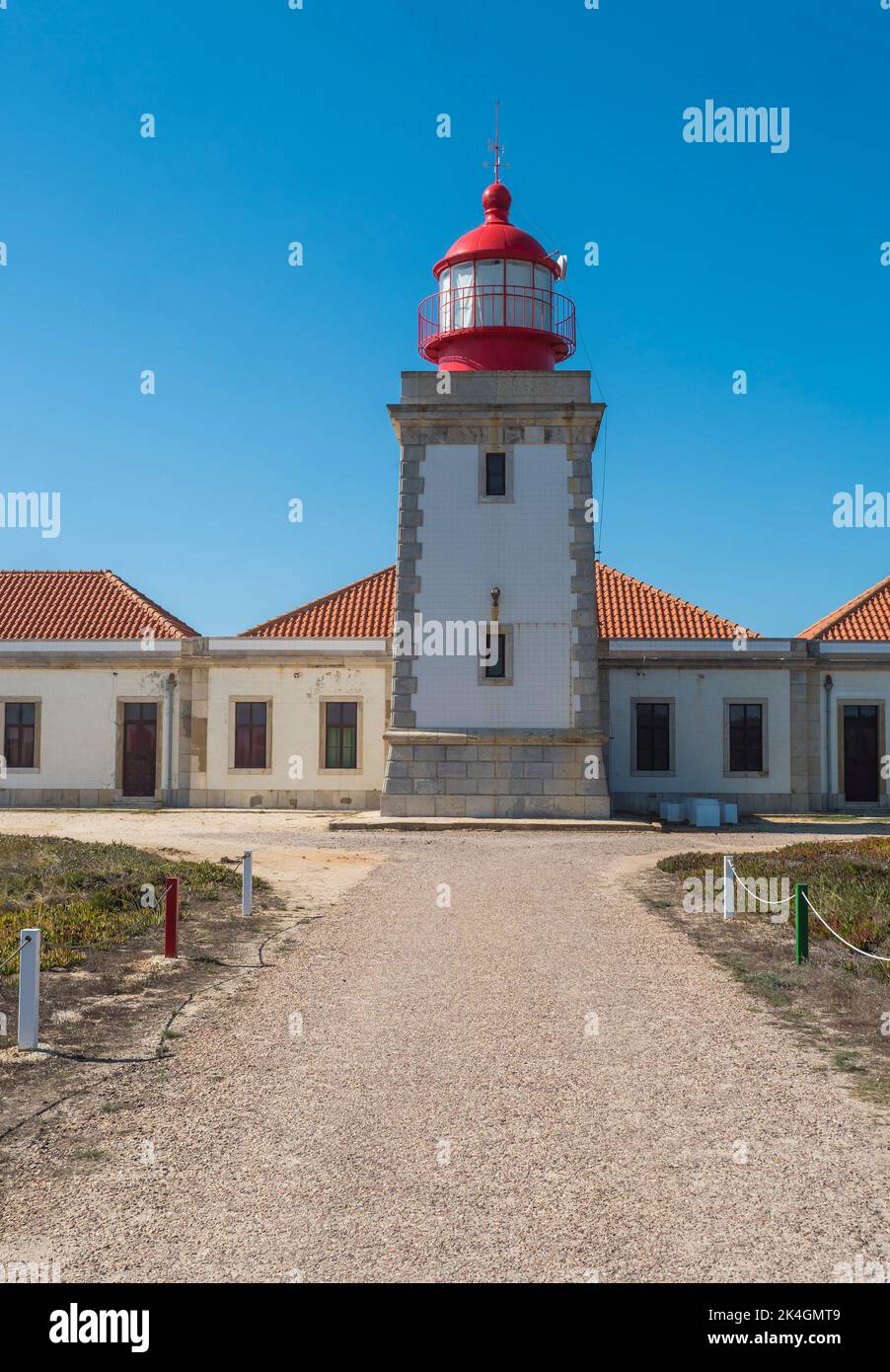 Frontal view of typical red and white historic Portugese lighthouse ...