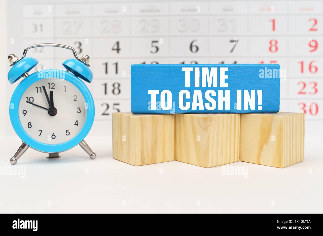 Time concept. Against the background of the calendar is an alarm clock ...