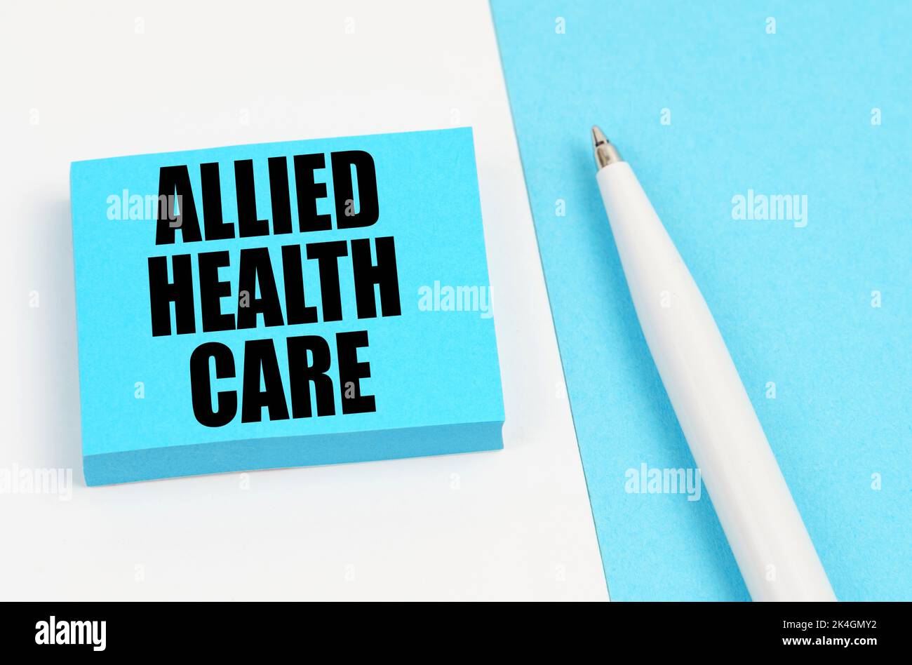 Medical concept. On a white and blue surface, a pen and blue stickers ...