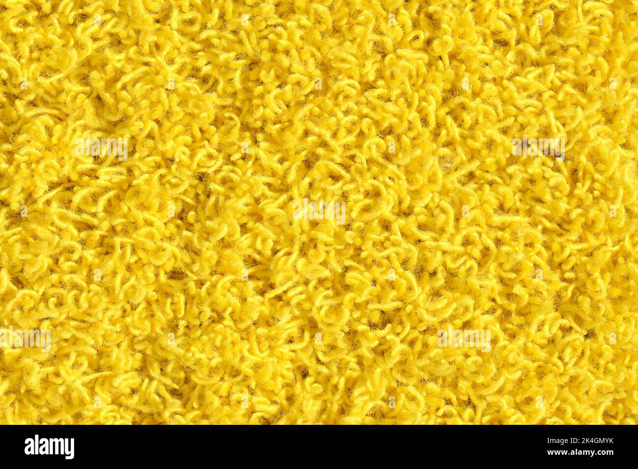 Close up of fabric textile carpet background, yellow color Stock Photo ...