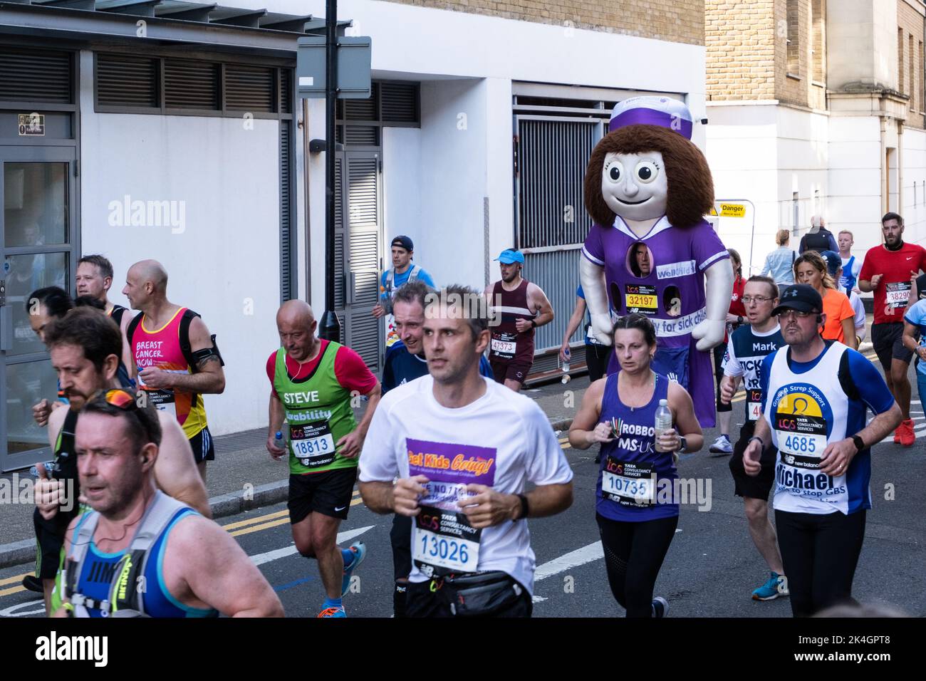 Fancy dress Giant Nurse runner in the London Marathon 2022 at Narrow ...