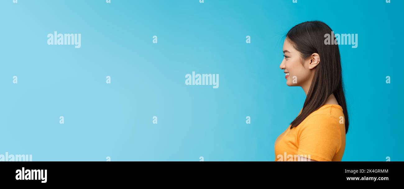 Profile shot asian cute woman perfect skin, turn left, smiling joyfully ...