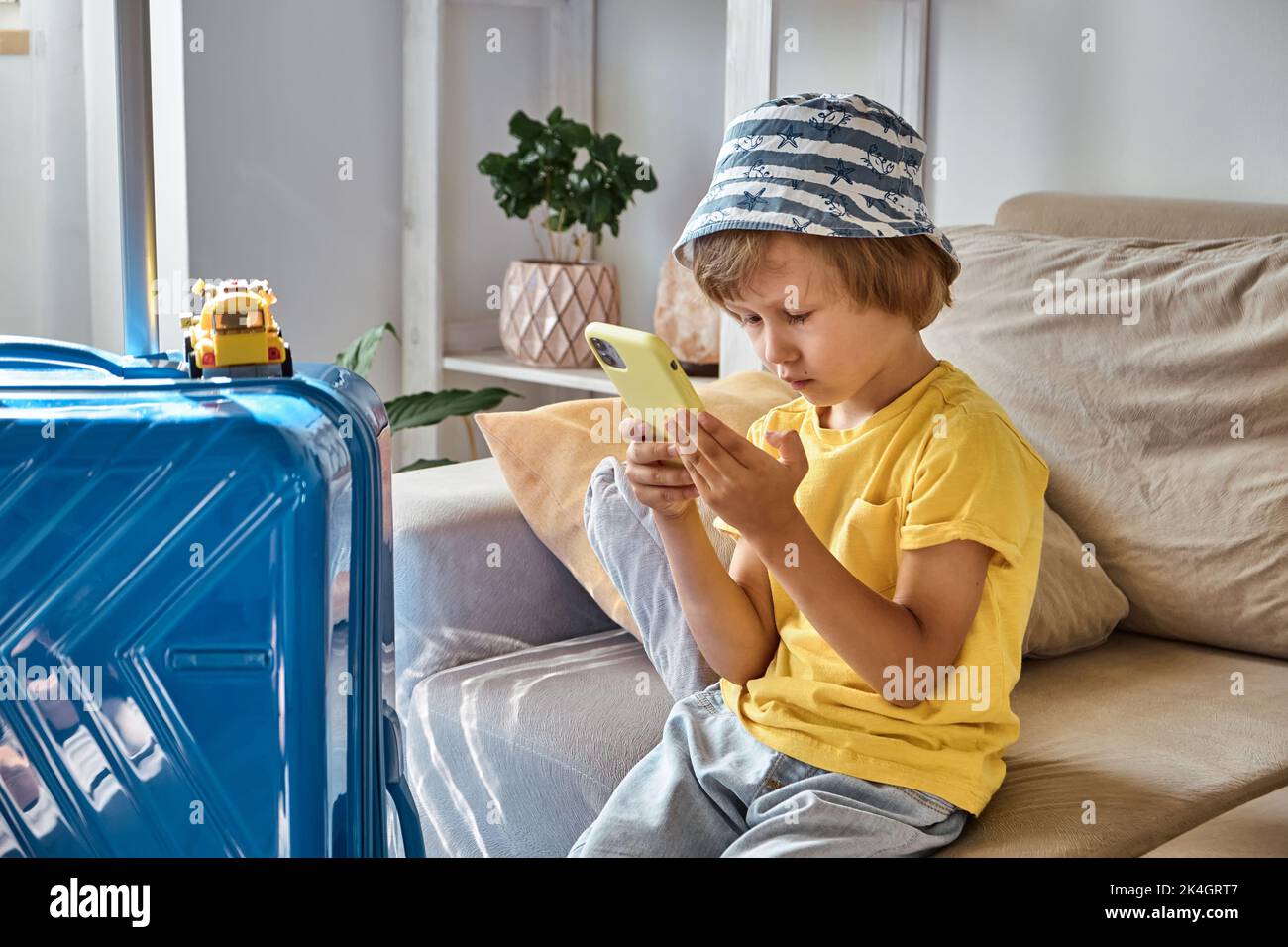 Child using phone on resort hi-res stock photography and images - Alamy
