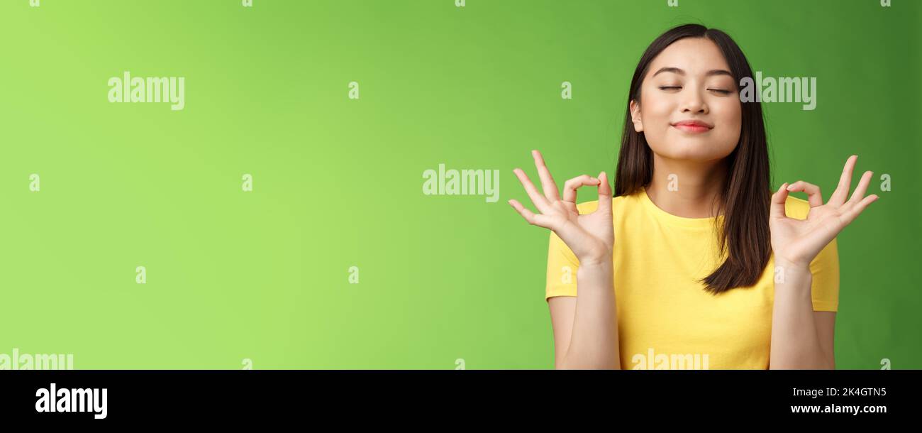 Peaceful charming asian girl brunette inhale fresh air, relaxing ...