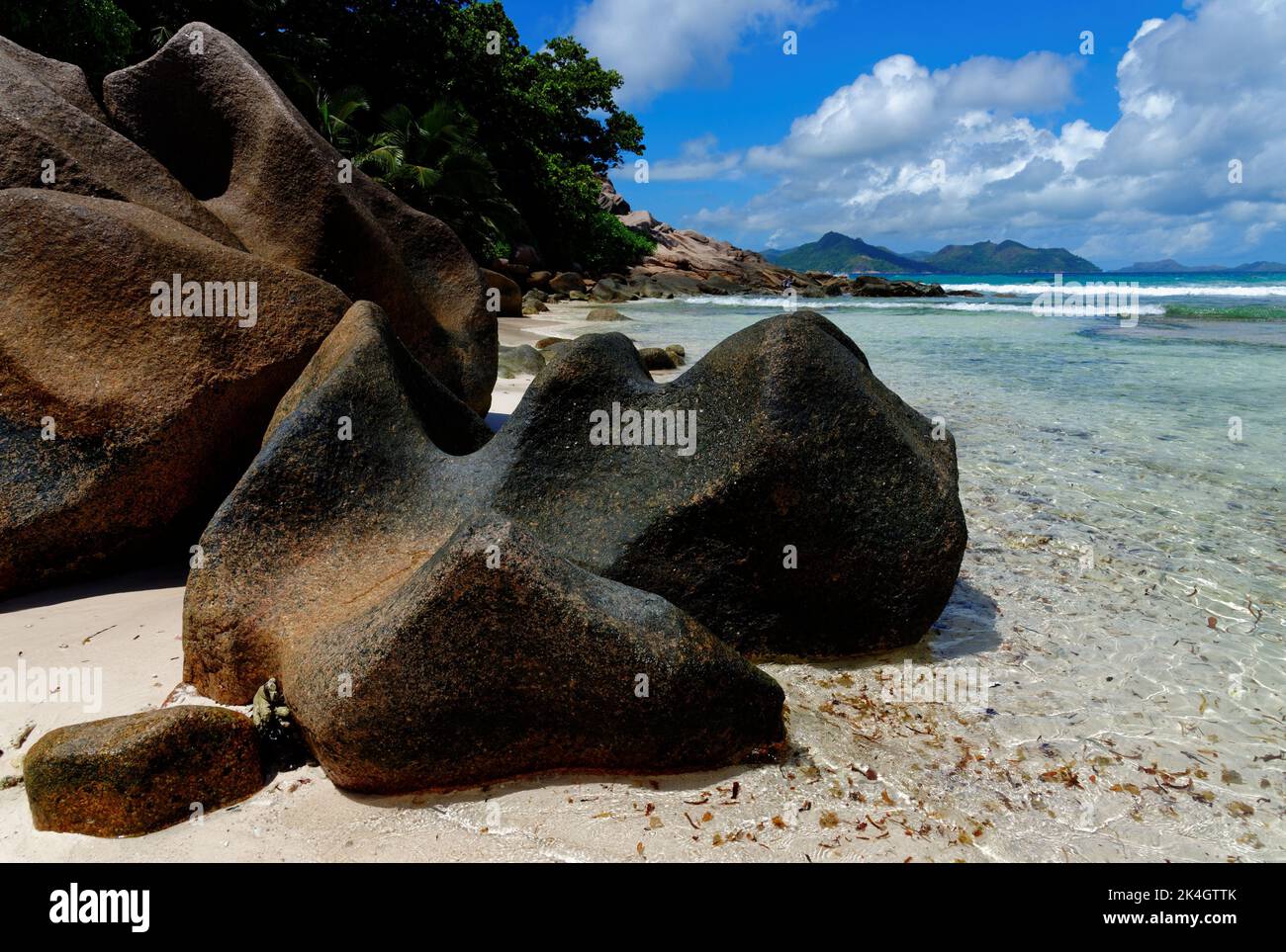 Scenic granite rocks and ocean at Anse Severe beach on La Digue island ...