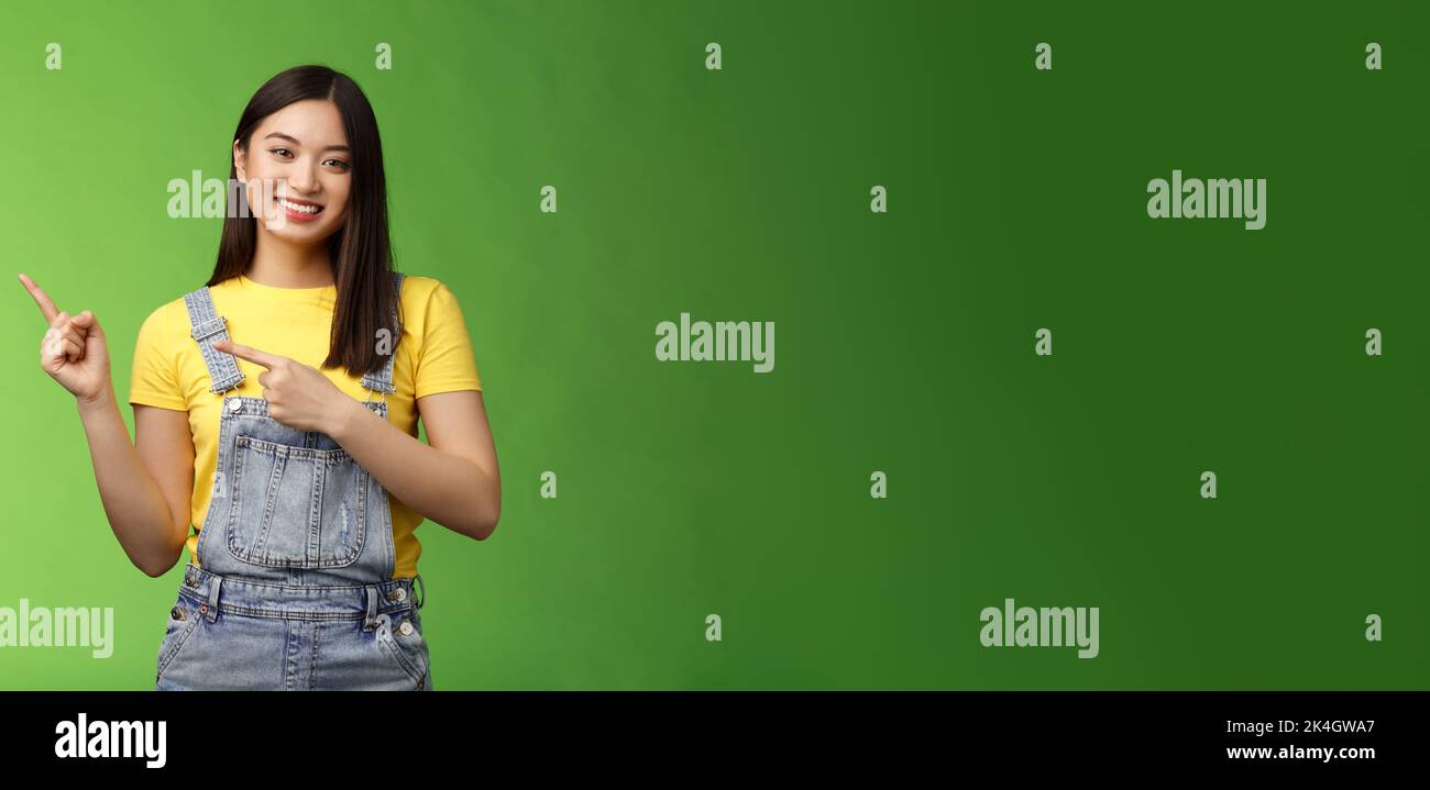 Lovely pretty tender asian woman showing way, tilt head flirty smiling ...