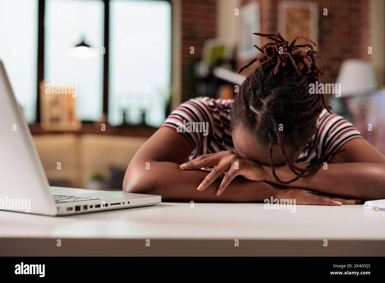 Overworked freelancer sleeping on table at daytime, sleepy stressed ...