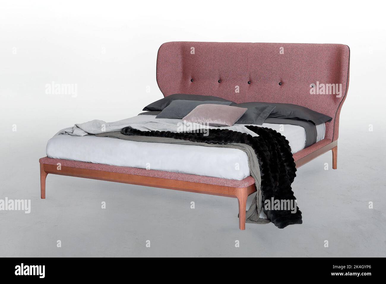 Bed in retro style with pink frame and headboard, side view Stock Photo ...