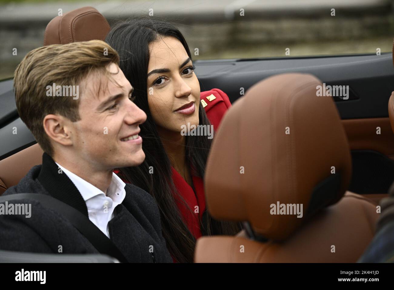 Belgian Remco Evenepoel and his girldfriend Oumi Rayane sit in a ...