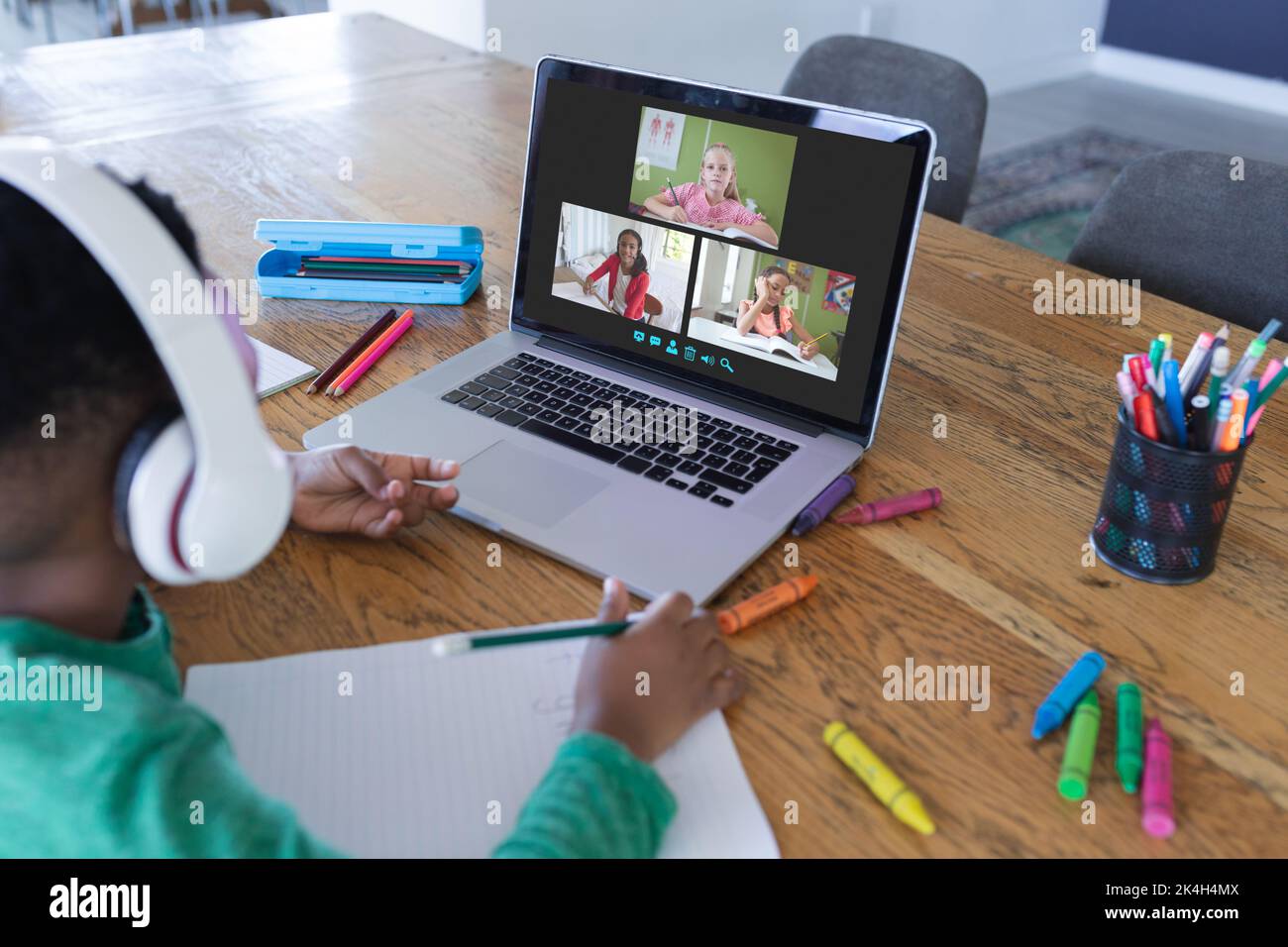 African american boy using laptop for video call, with diverse ...