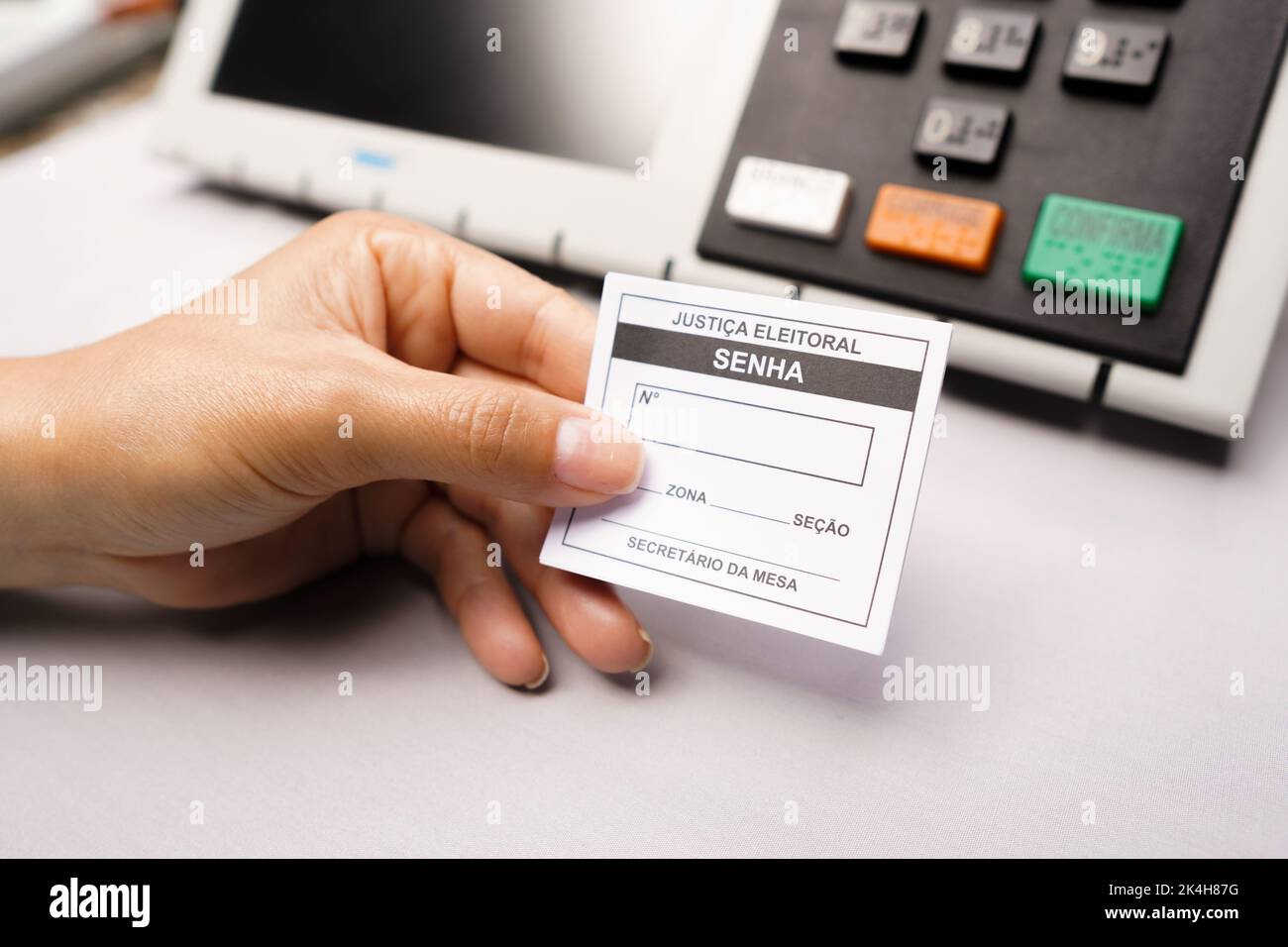 In this photo illustration, a person shows password form for voting ...