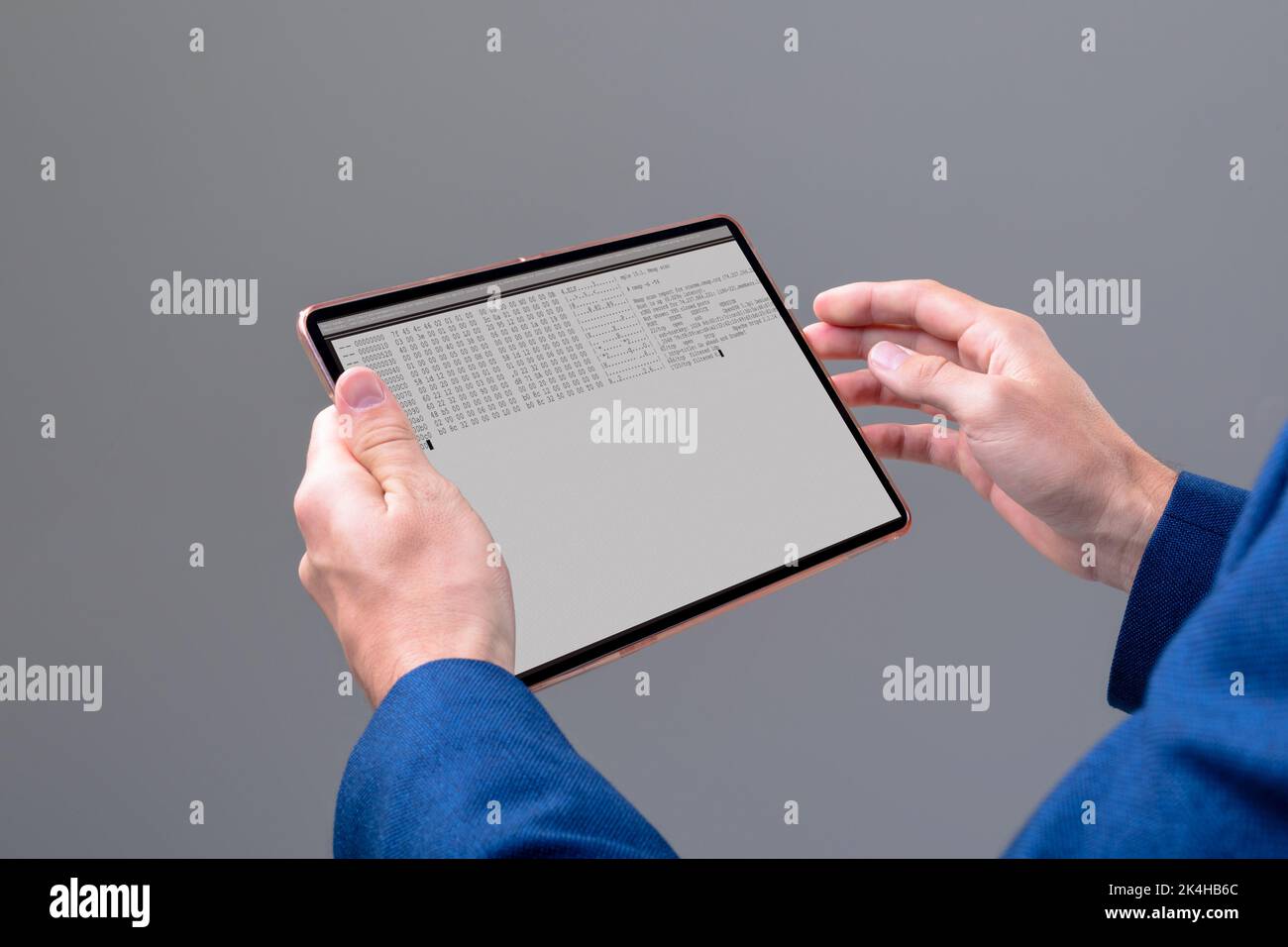 Hands Of Caucasian Male Programmer Using Tablet With Coding On Screen