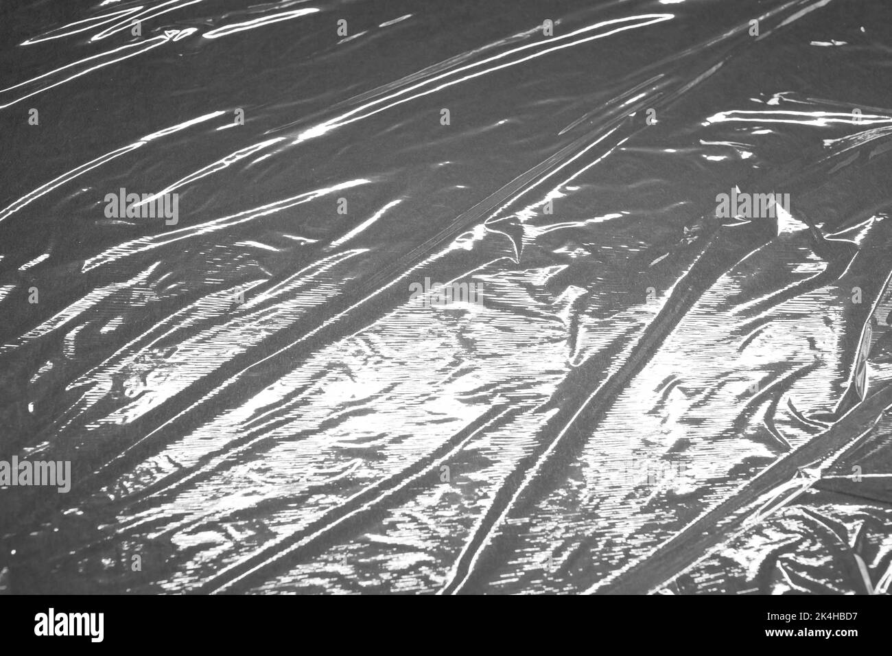 Reflecting light and shadow on creases and folds in plastic sheeting ...