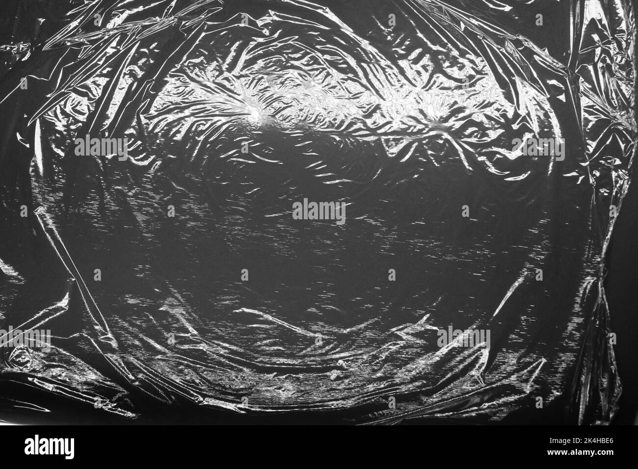 Reflecting light and shadow on creases and folds in plastic sheeting ...