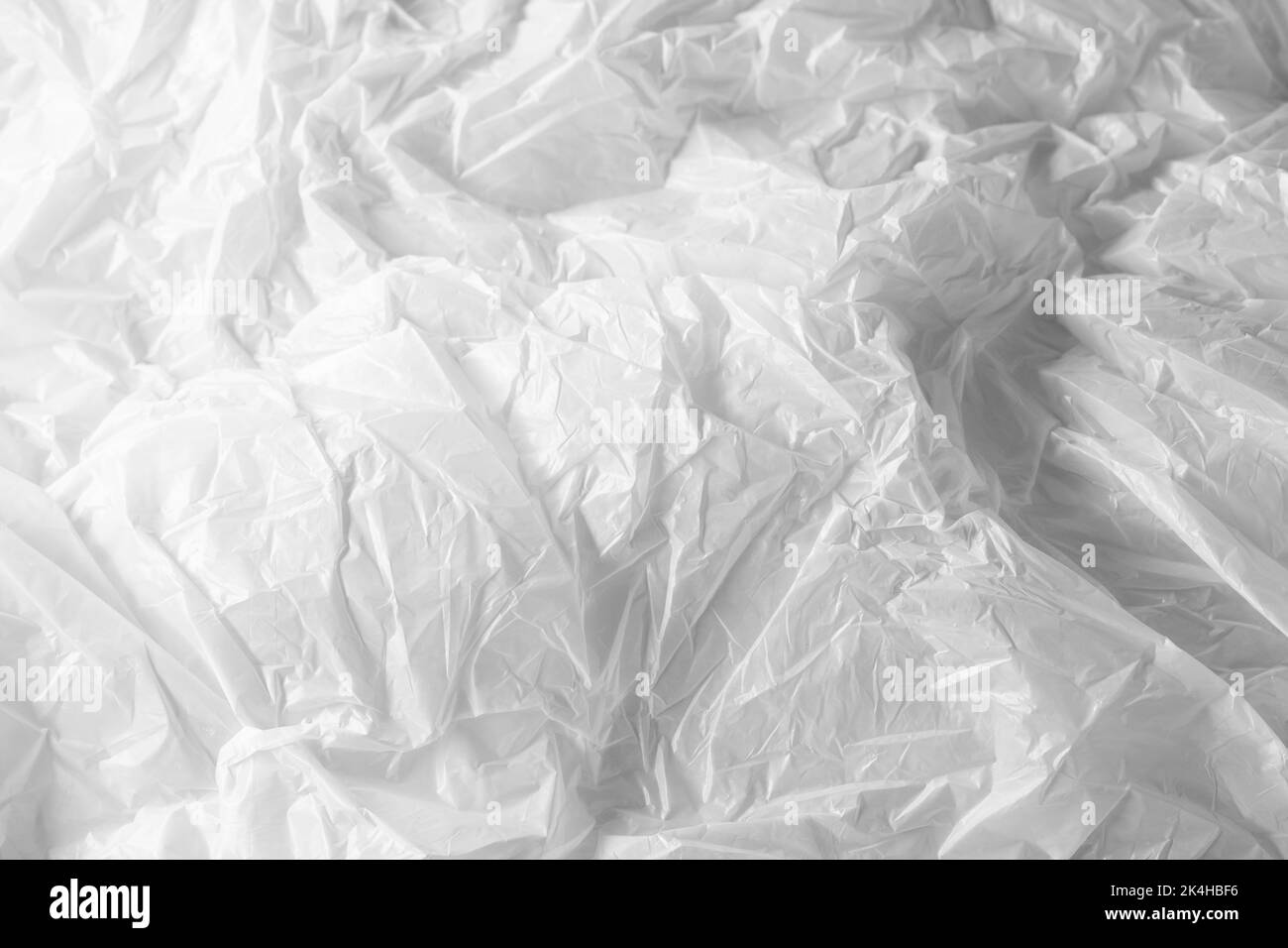 Reflecting light and shadow on creases and folds in scrunched thin ...