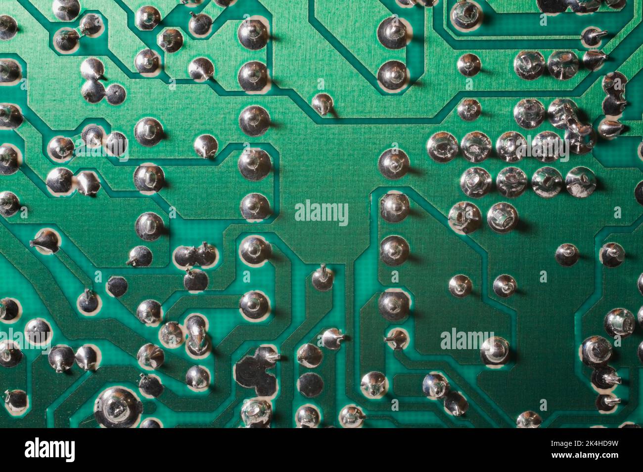 Green computer circuit board with silver solder points Stock Photo - Alamy