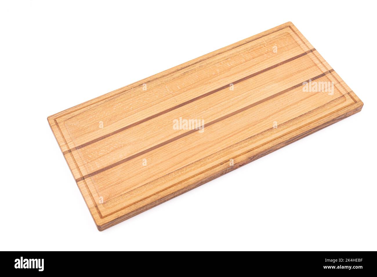 A rectangular shaped wooden cutting board isolated on a white ...