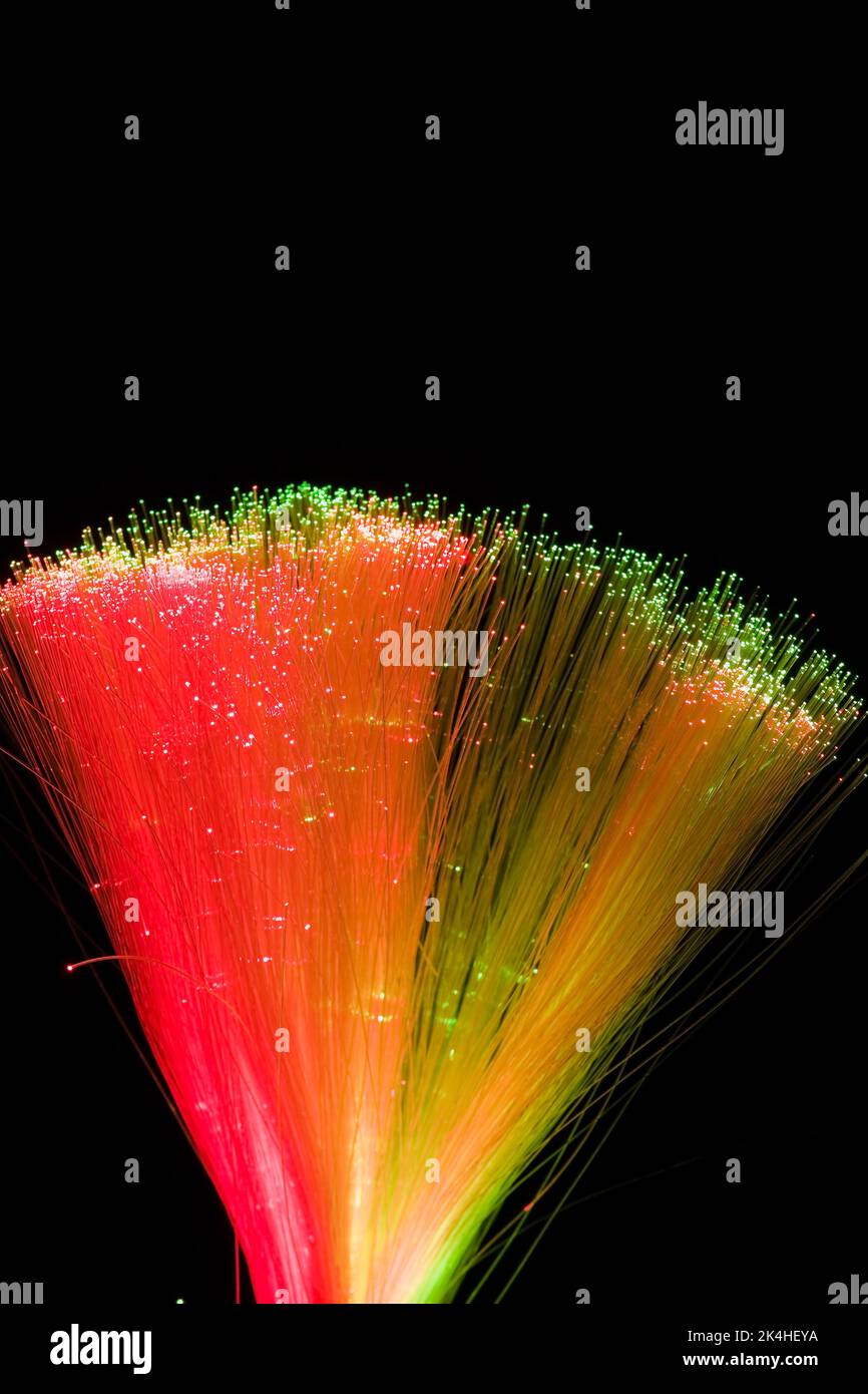 Lit bundle of red green and yellow fibre optic strands Stock Photo - Alamy