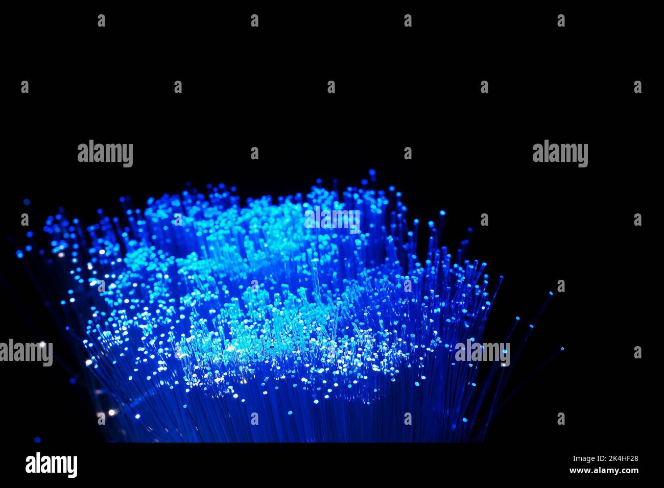 Bundle of blue lighted fibre optic strands Stock Photo - Alamy