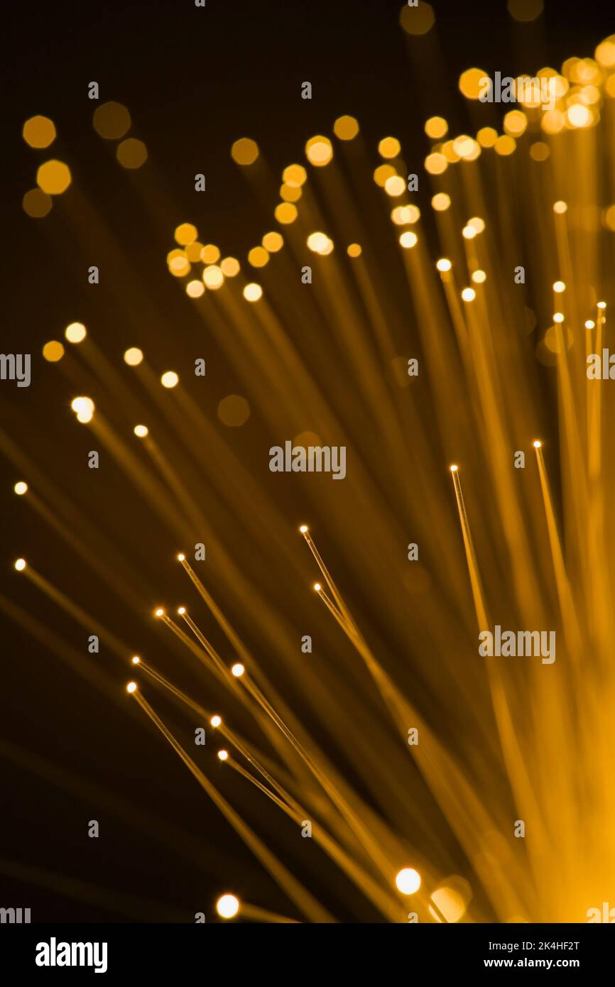 Yellow lighted fibre optic strands Stock Photo - Alamy
