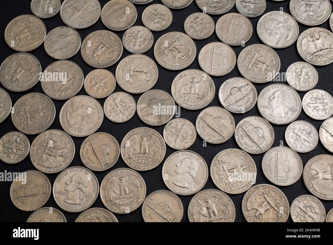 Assorted US coins on black background Stock Photo - Alamy