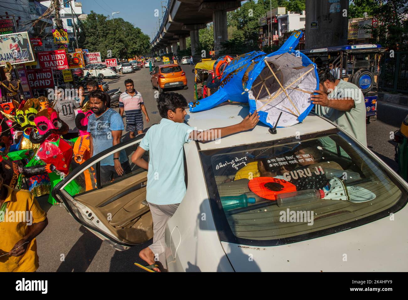 New Delhi, India. 02nd Oct, 2022. A family carries an effigy of Ravana ...