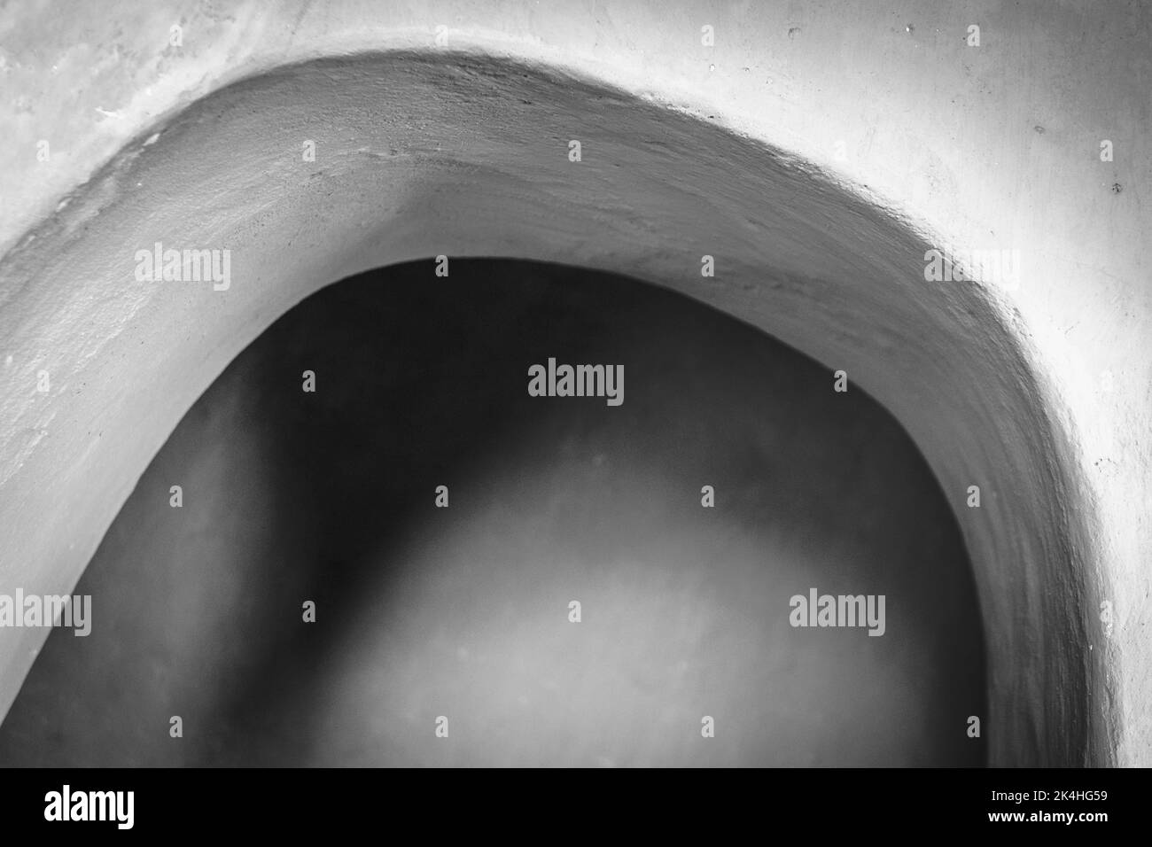 Curves and arches makes up this doorway that leads to a hall. Thick ...