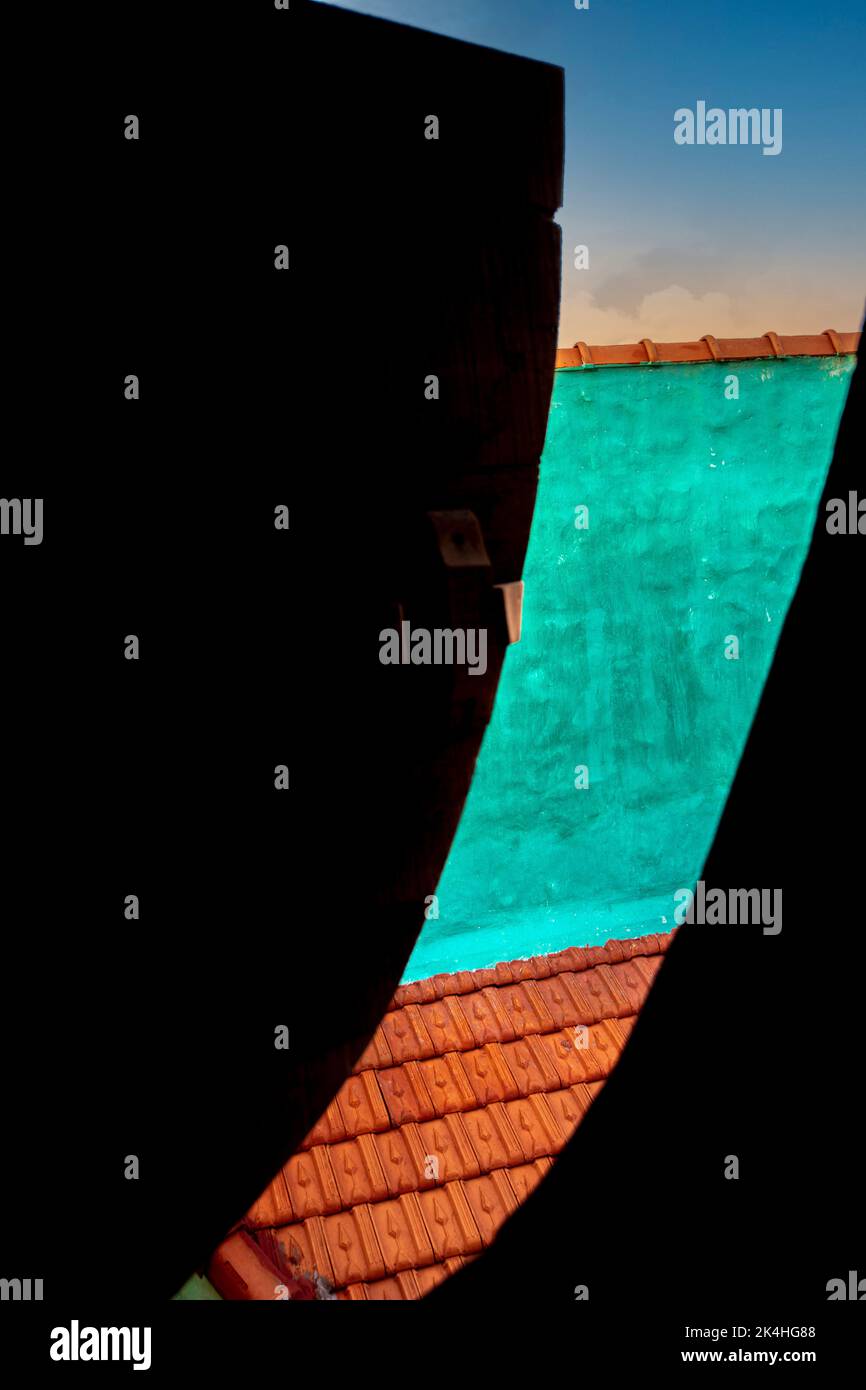 Hatch cover from an old fishing boat is cracked open showing sky, and ...