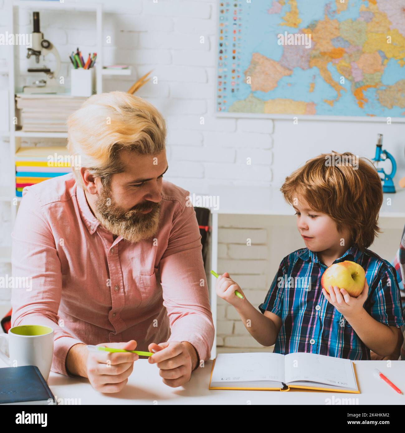 Father teaching son. Cute little boy study and learn with teacher dad ...