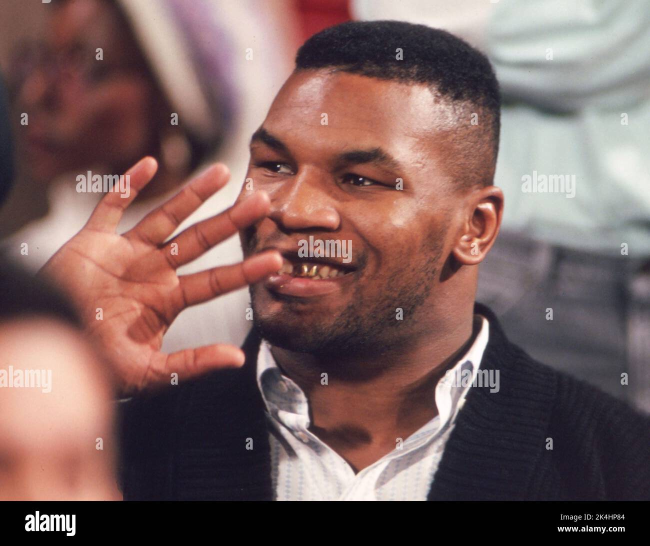 World heavyweight boxing champion Mike Tyson waves to the crowd while ...