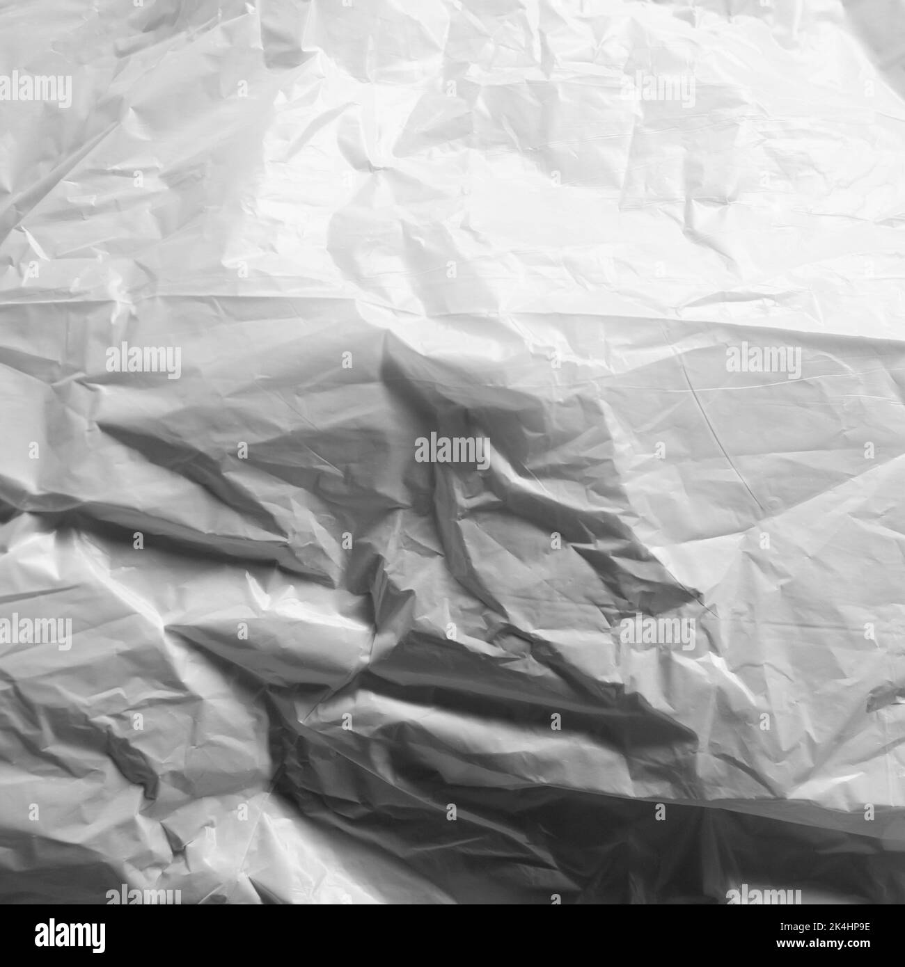 Reflecting light and shadow on creases and folds in scrunched thin ...