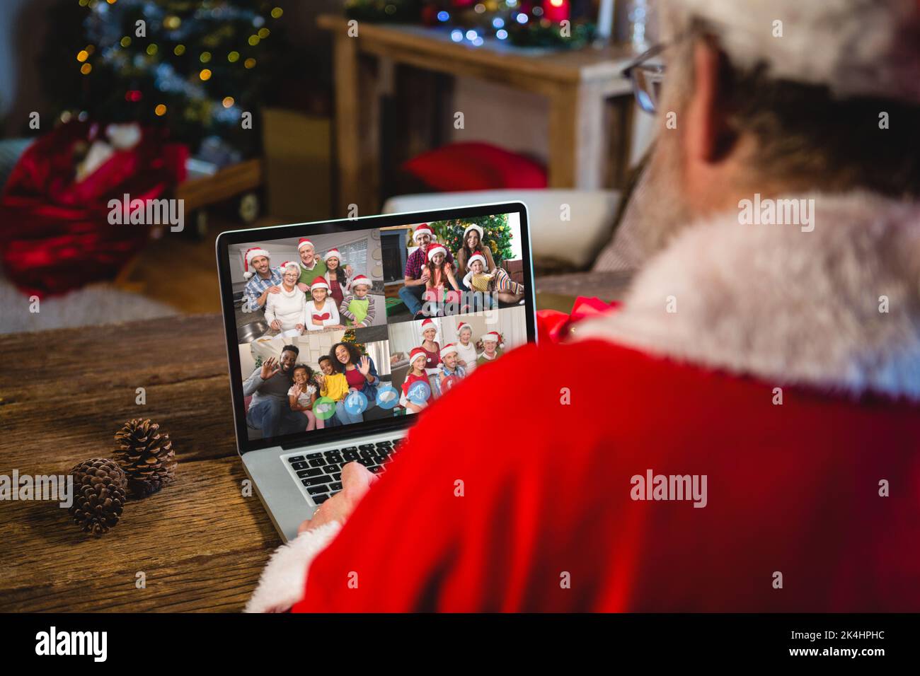Santa claus making christmas laptop video call with four diverse ...
