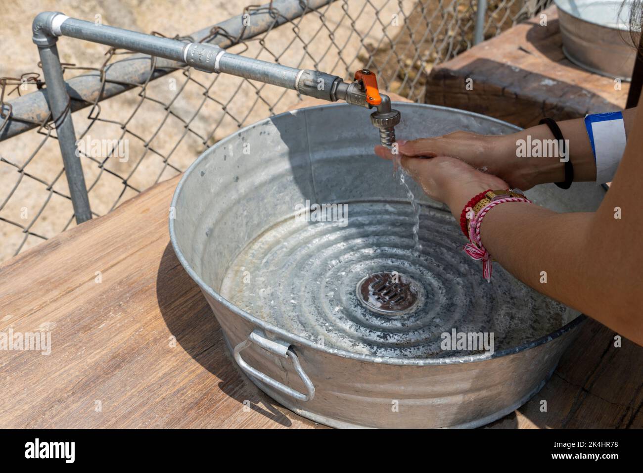 Hands open for drinking tap water. Pouring fresh healthy drink. Good ...