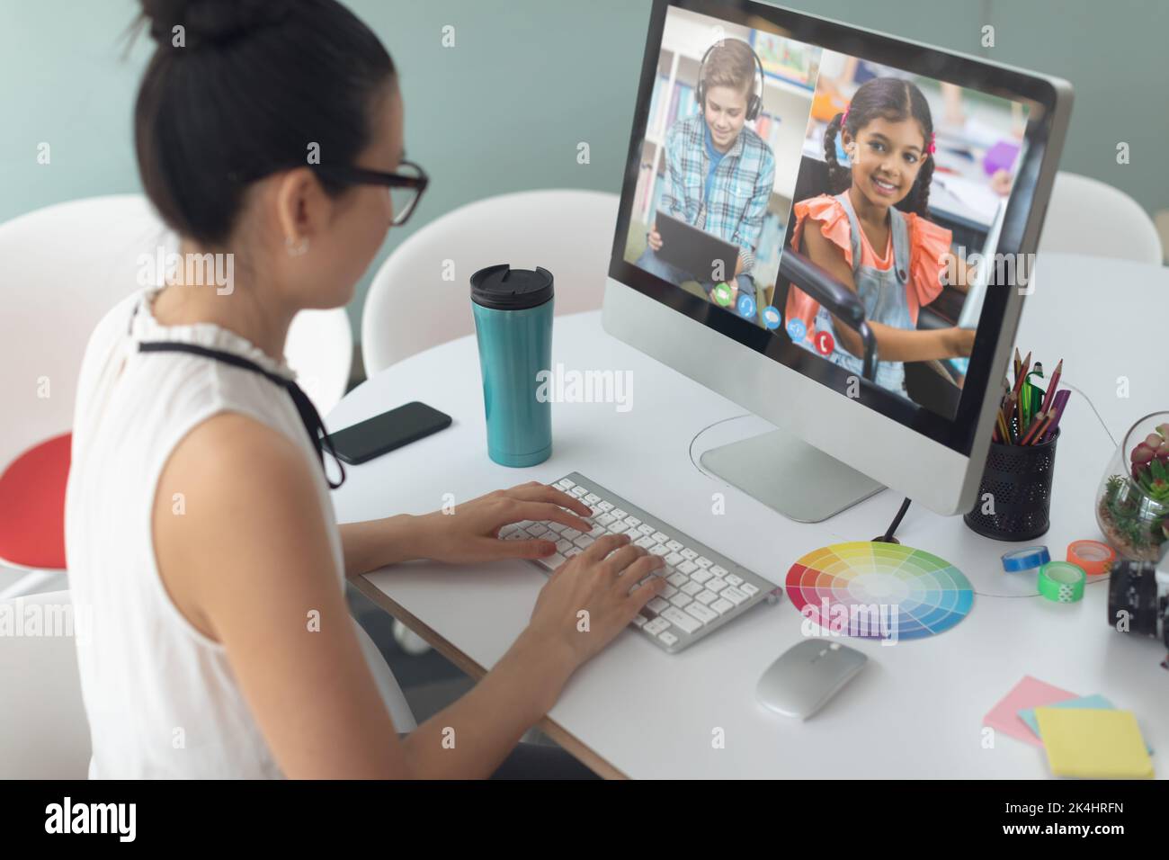 Asian girl using computer for video call, with smiling diverse ...