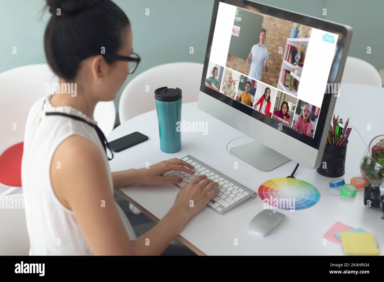 Asian girl using computer for video call, with smiling diverse ...