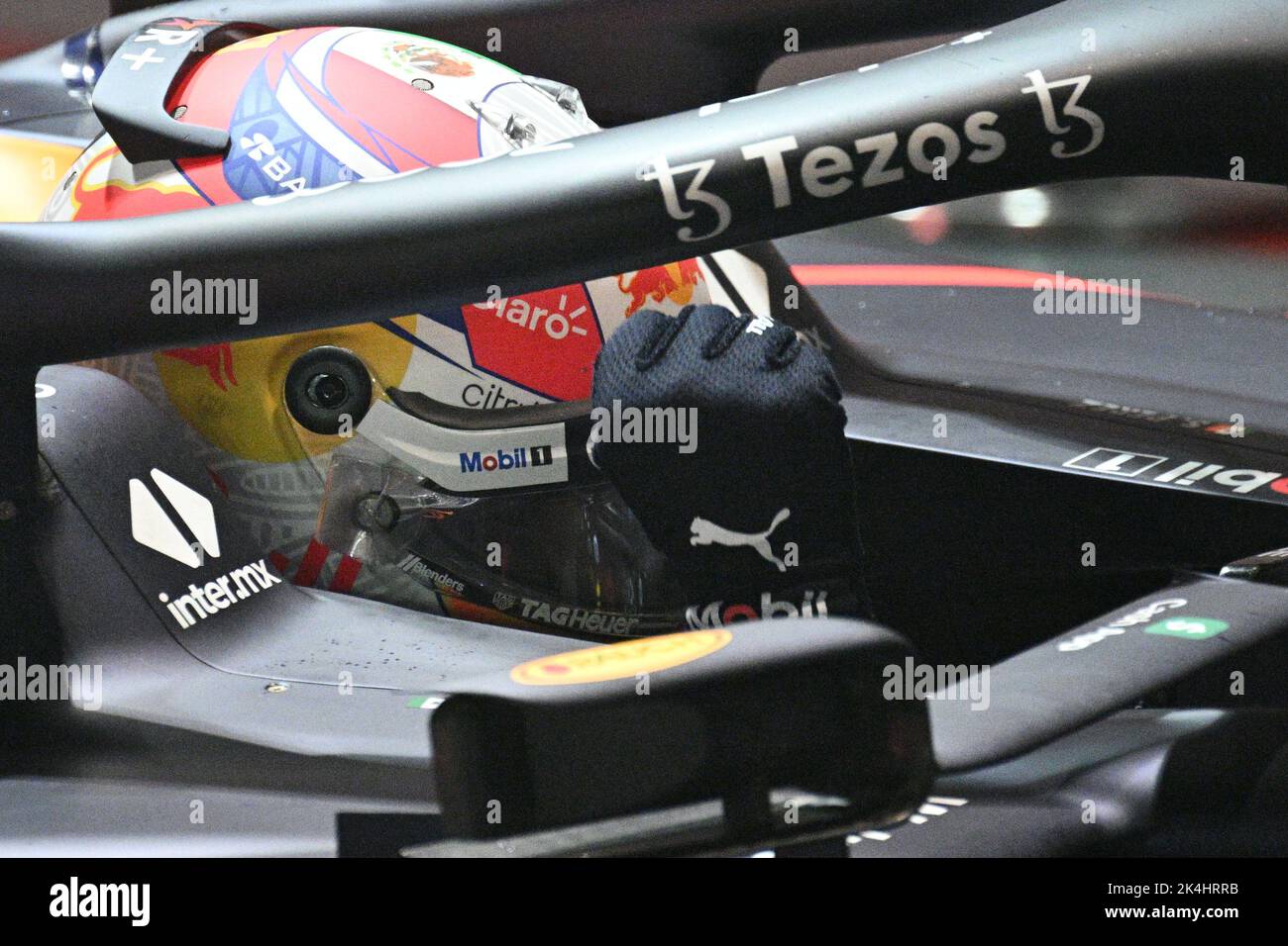 Singapore. 2nd Oct, 2022. Red Bull's Mexican driver Sergio Perez reacts after winning the ...