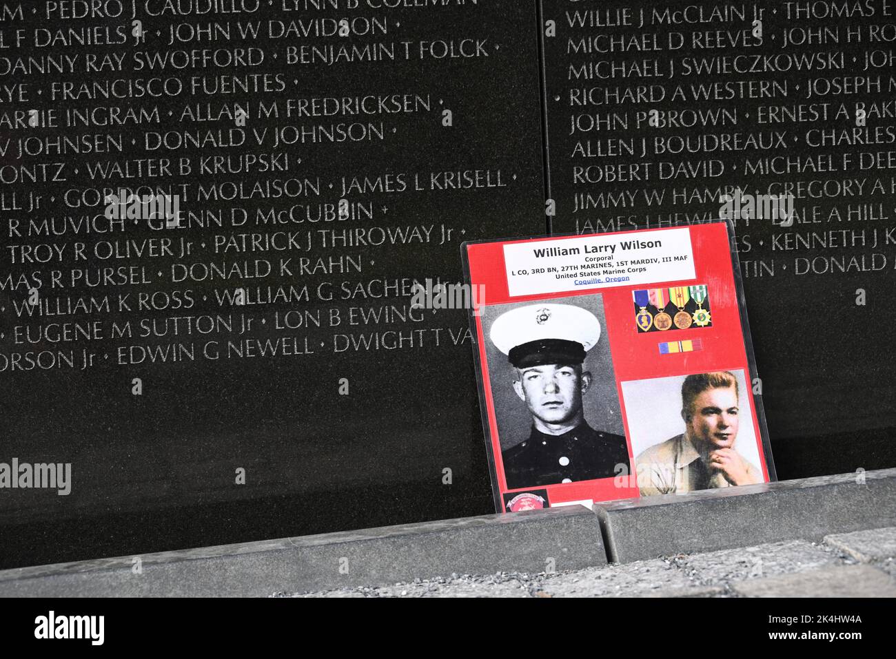 A memorial poster is left as a tribute at the base of the Vietnam ...