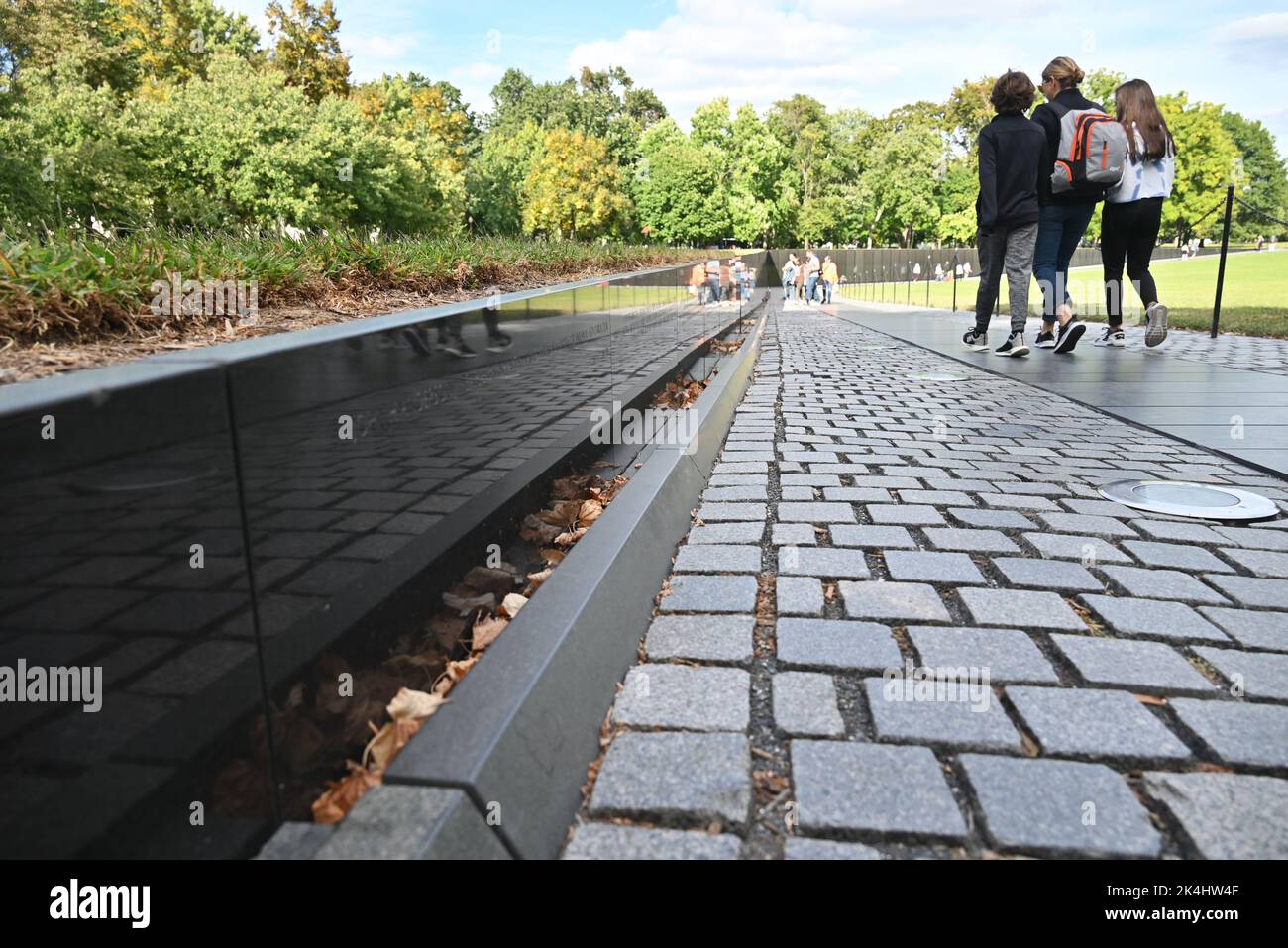 Visitors walk down the path to the Vietnam Memorial Wall in Washington ...