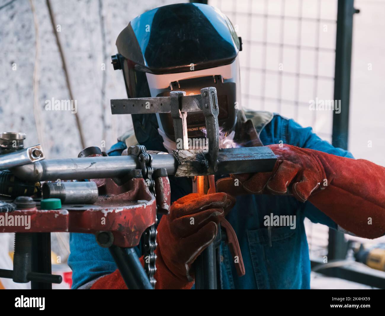 Iron soldering, Man working on iron soldering, welding sparks, men ...