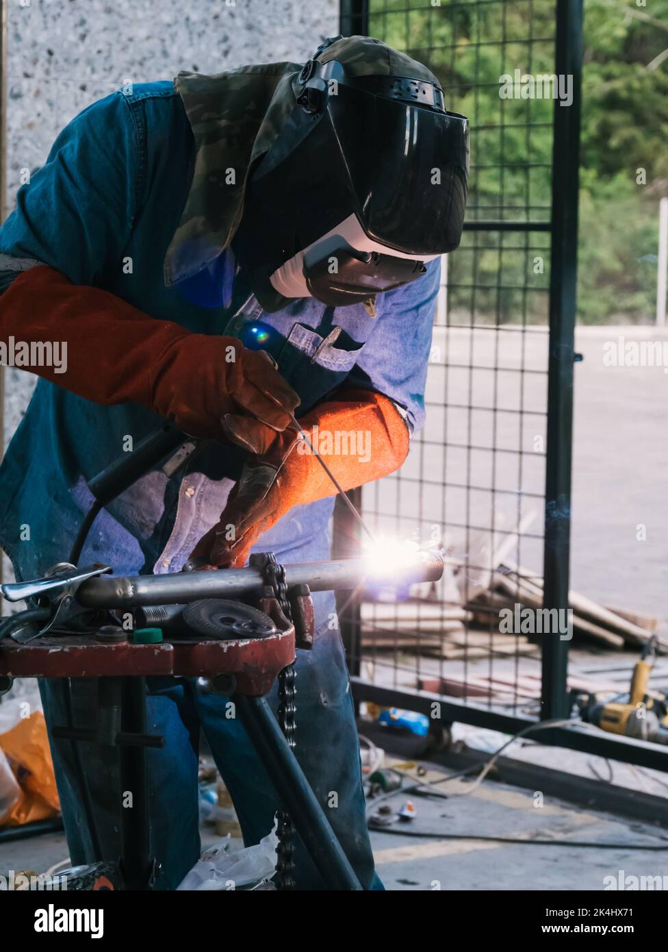 Iron soldering, Man working on iron soldering, welding sparks, men ...