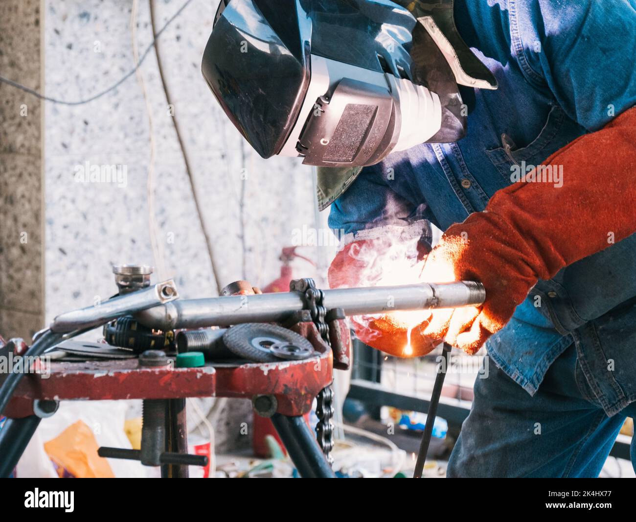 Iron soldering, Man working on iron soldering, welding sparks, men ...