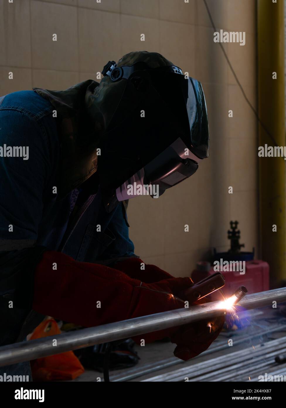 Iron soldering, Man working on iron soldering, welding sparks, men ...