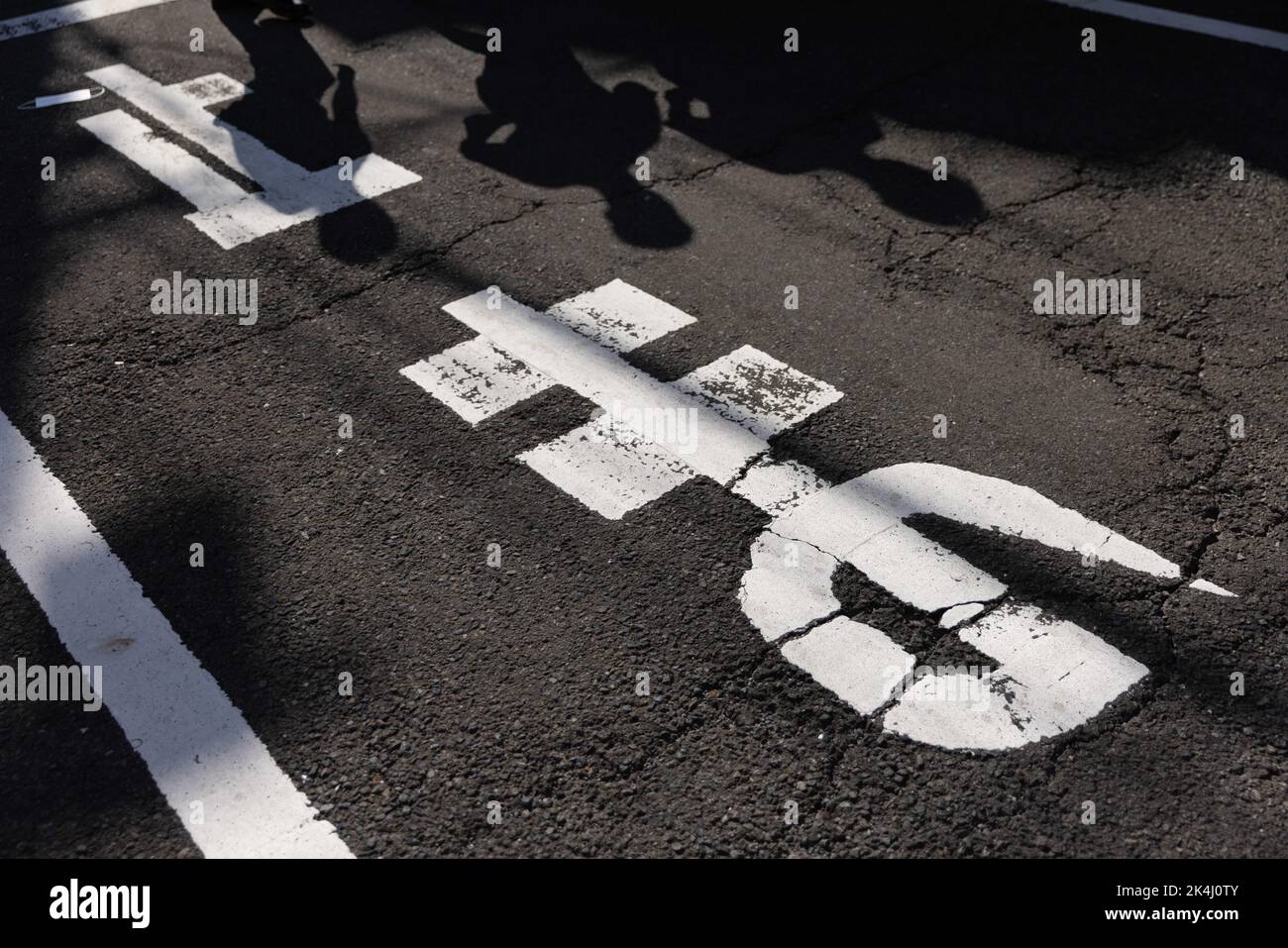 Tokyo, Japan. 02nd Oct, 2022. Stop sign with human shadows seen in ...