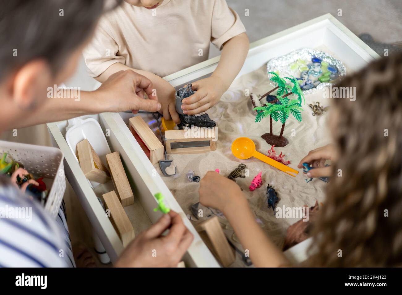 Closeup woman parent and children hands playing early development ...