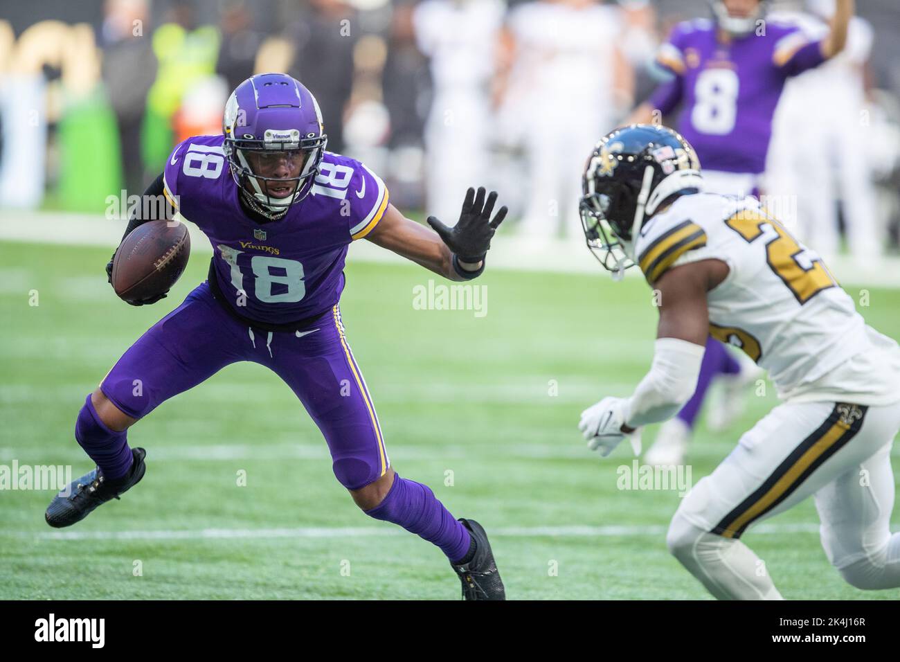 Minnesota Vikings wide receiver Justin Jefferson (18) attempts to avoid ...