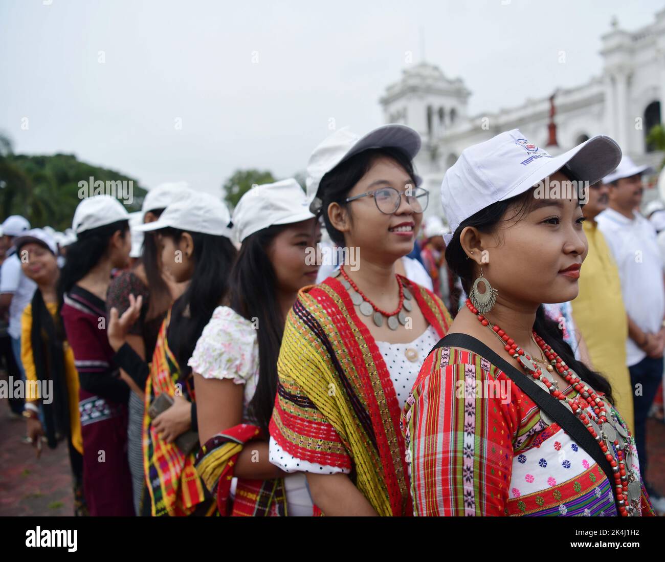 Indigenous people are walking with traditional folk dresses during a ...
